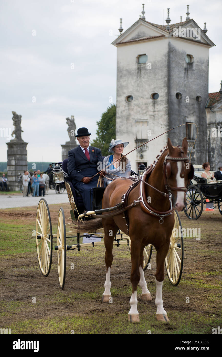 an old carriage with people in costume Stock Photo - Alamy