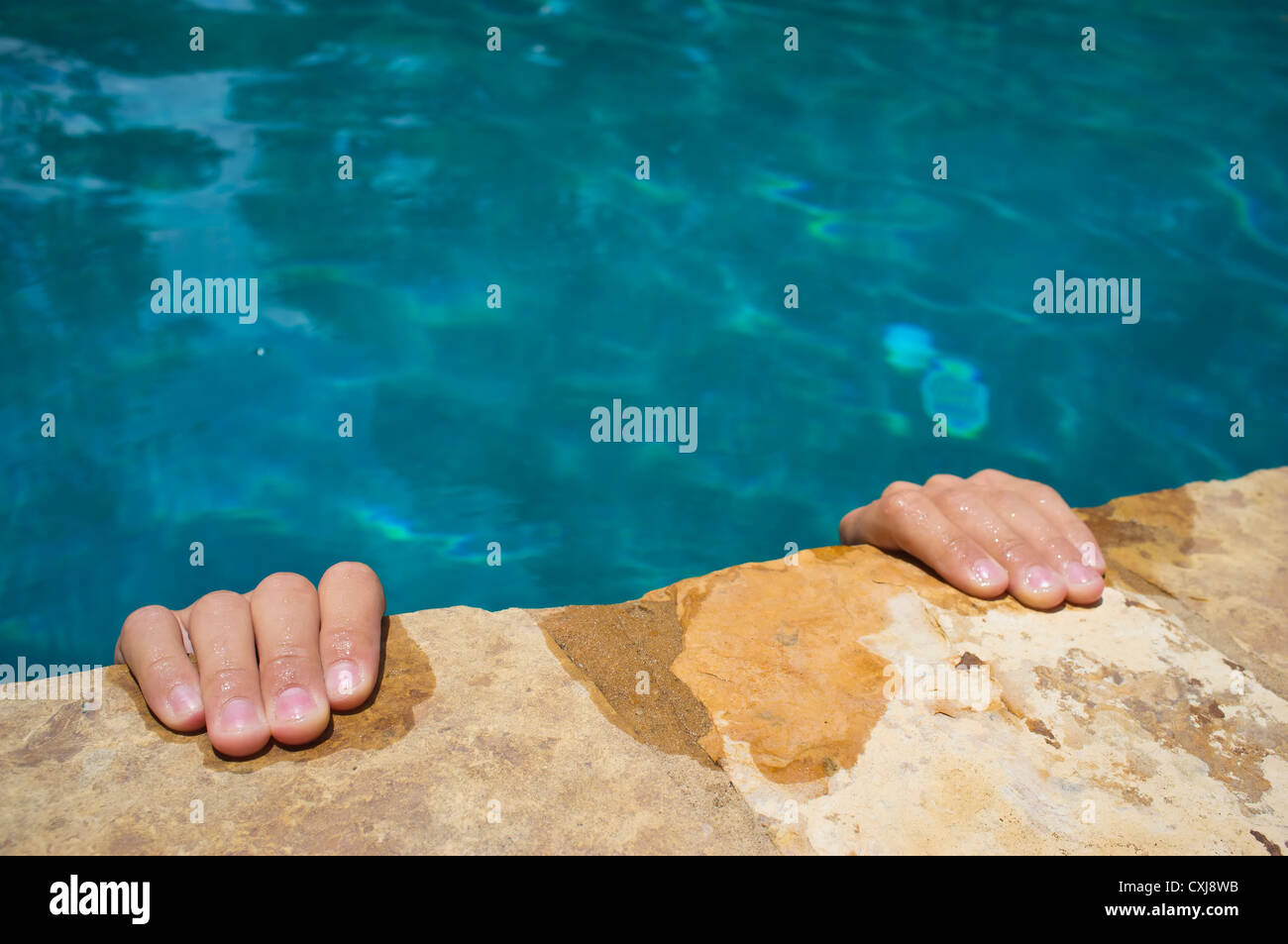 USA, Texas, Human hands grabbing edge of swimming pool Stock Photo - Alamy