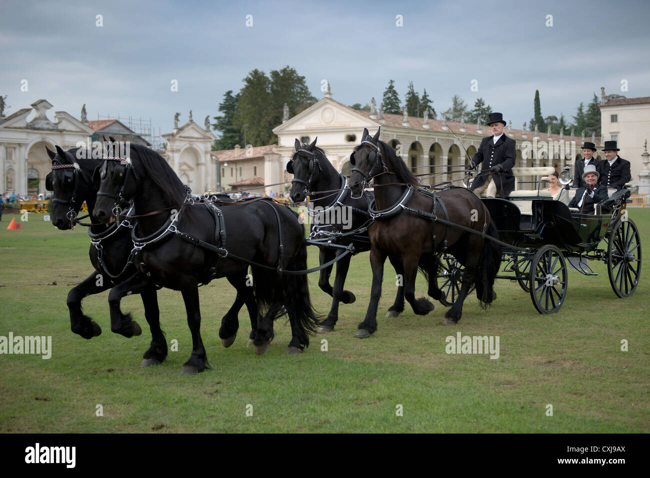 an old carriage with people in costume Stock Photo - Alamy