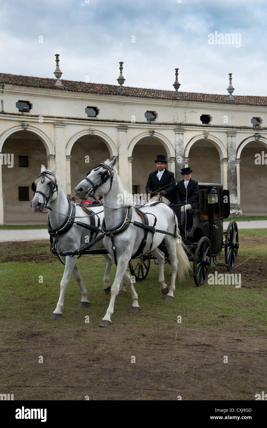 an old carriage with people in costume Stock Photo - Alamy