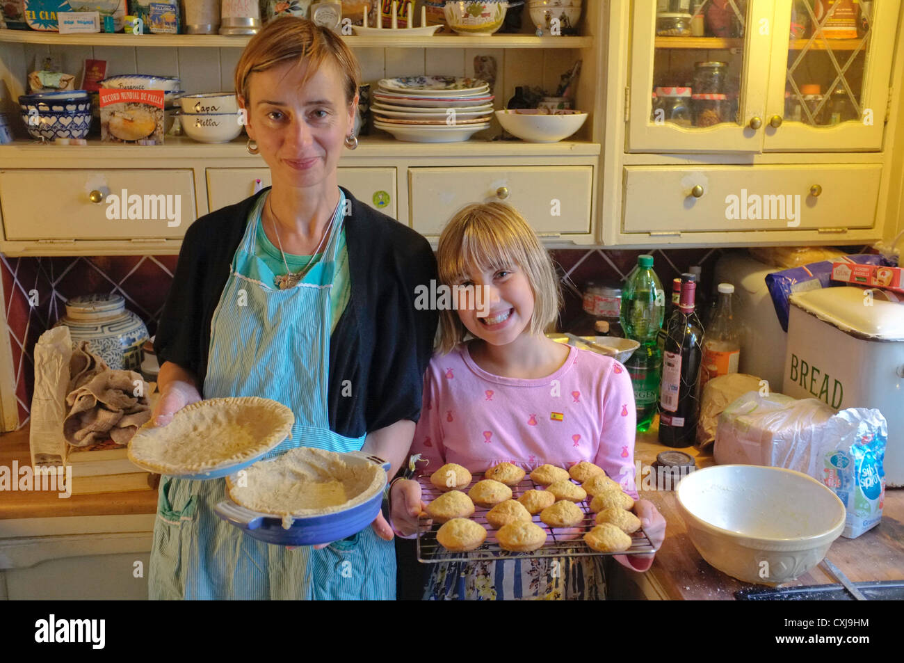 A mother and her daughter baking in the kitchen Stock Photo - Alamy
