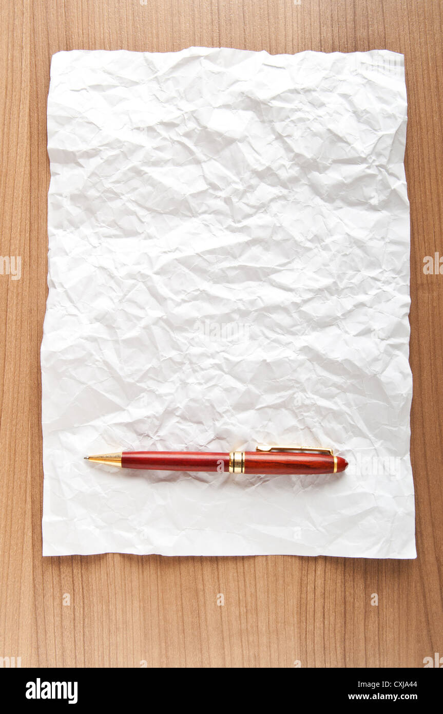 Paper background with pen Stock Photo - Alamy