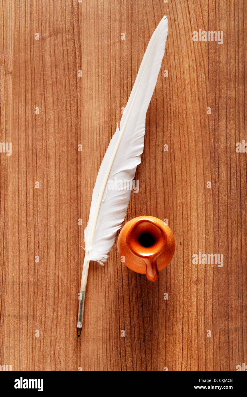 Writing feather on the background Stock Photo - Alamy