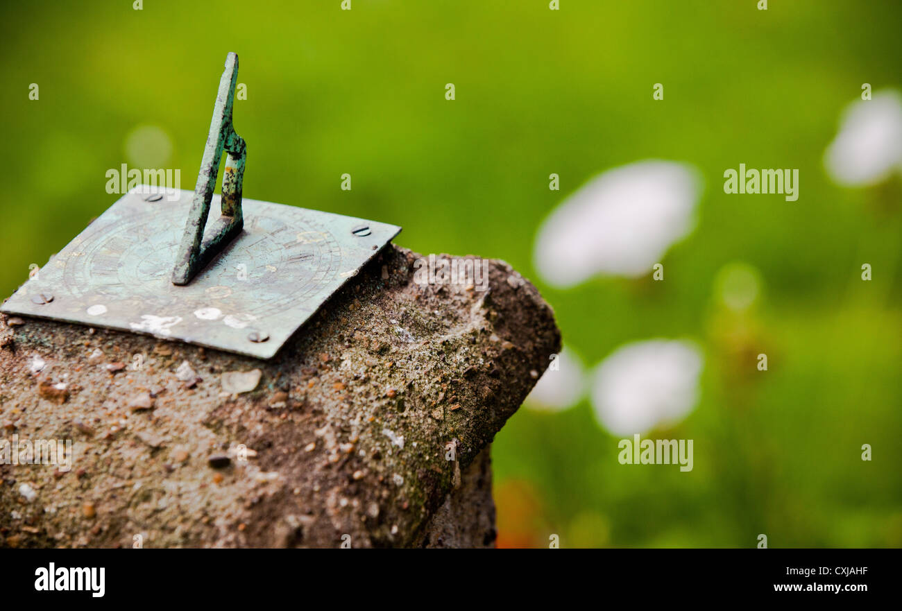 Sundial in garden Stock Photo - Alamy