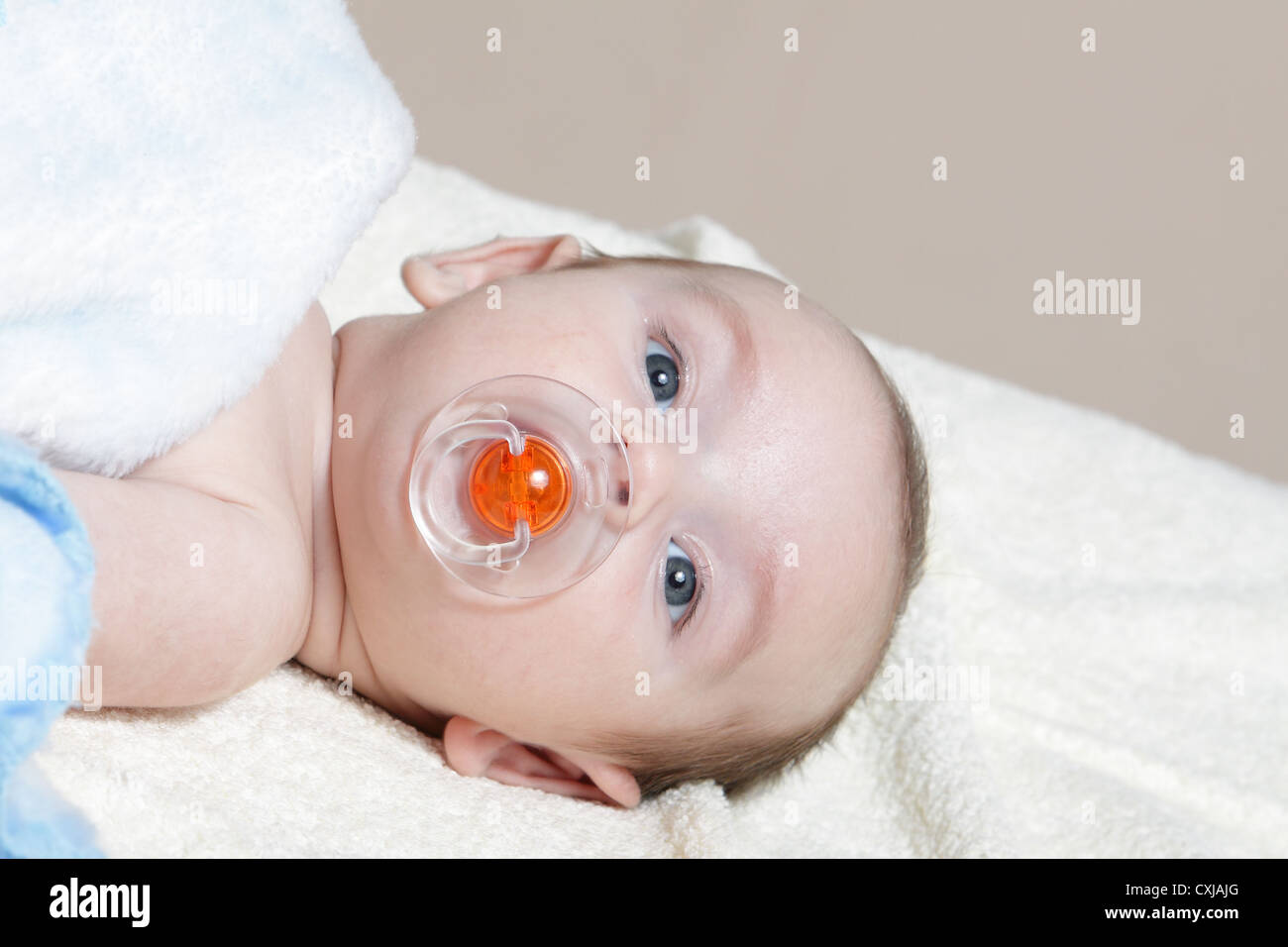 Newborn - close-up focus baby boy with blue pacifier Stock Photo - Alamy