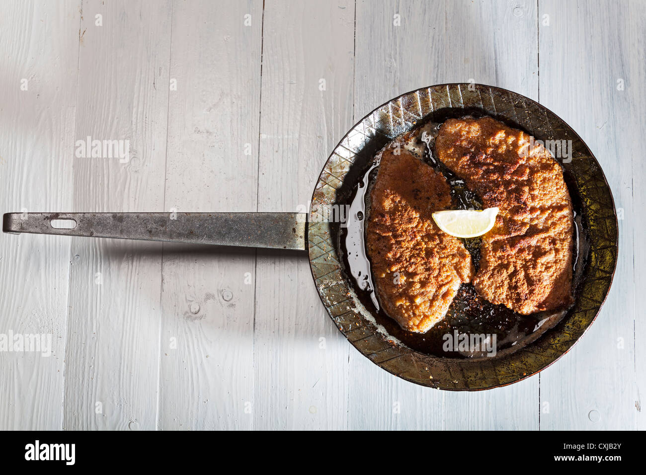Wiener Schnitzel in frying pan Stock Photo - Alamy