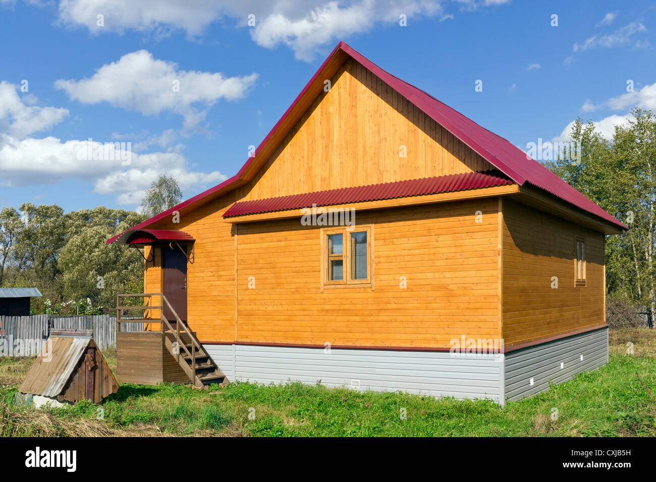 Rural rustic wooden house is made by hand. The walls of pine boards ...