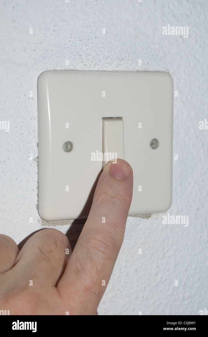 Finger pressing light switch hi-res stock photography and images - Alamy