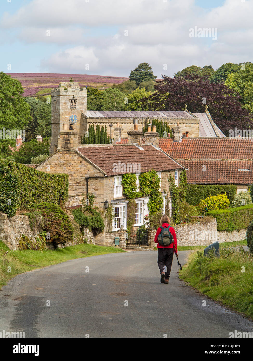 Walker at Lastingham village in the North York Moors National Park UK ...