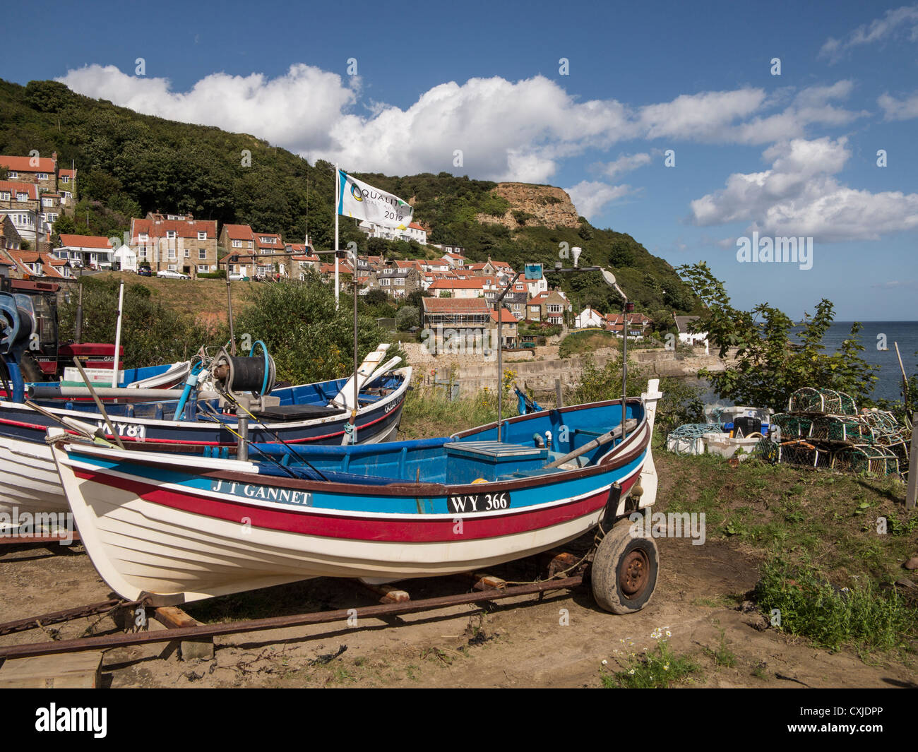 Runswick Bay North Yorkshire UK Fishing cobles and village Stock Photo ...