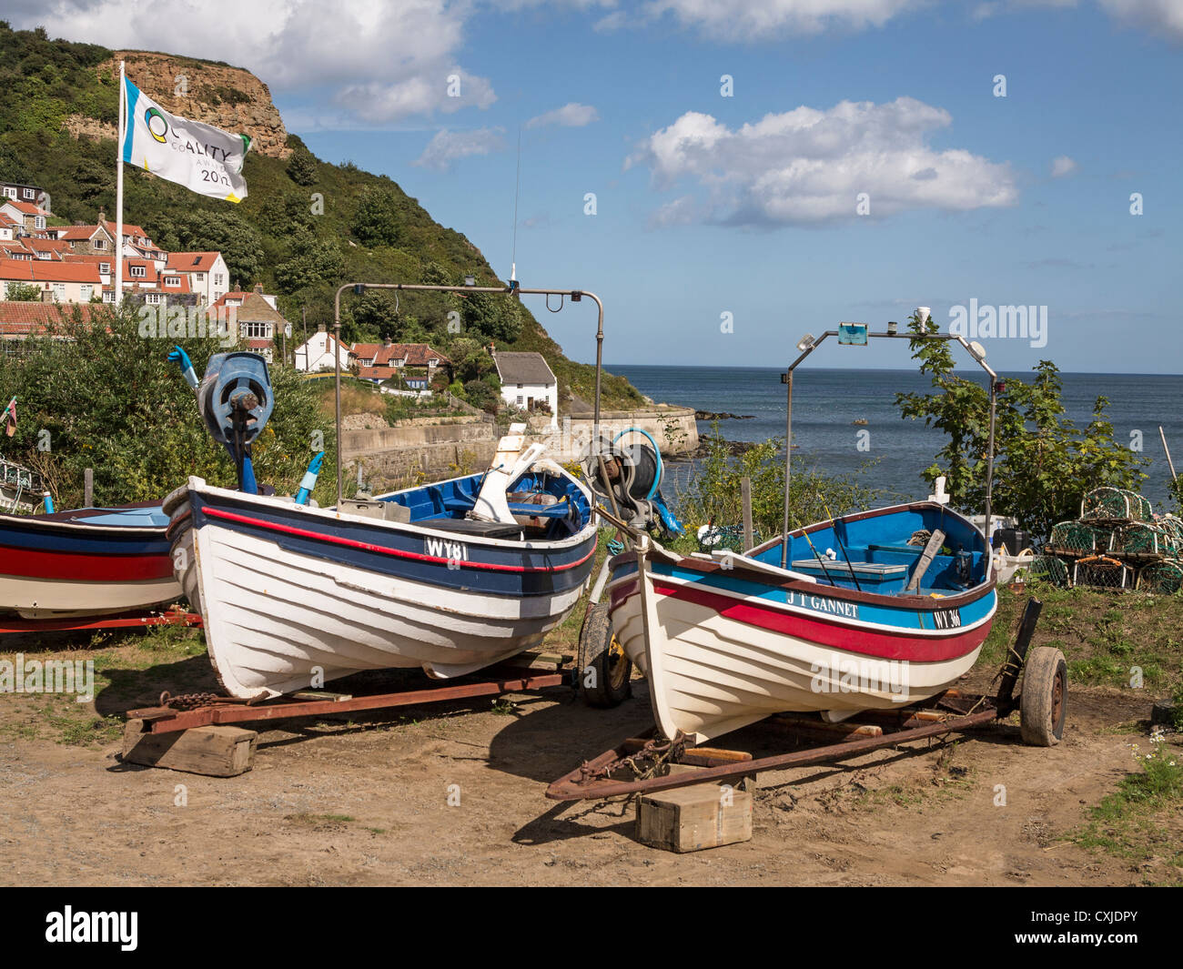 Runswick Bay North Yorkshire UK Fishing cobles and village Stock Photo ...