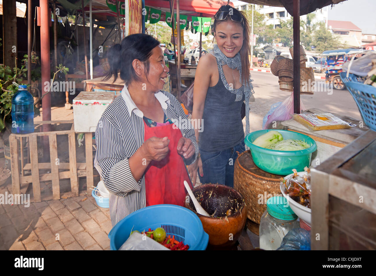 Customer and cook, food stall, Vientiane, Laos Stock Photo - Alamy
