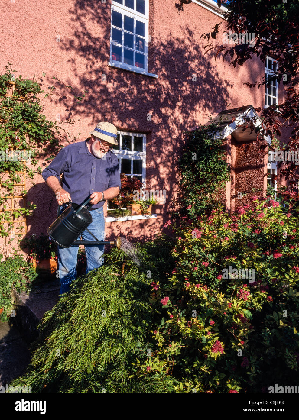 Man in front of cottage hi-res stock photography and images - Alamy