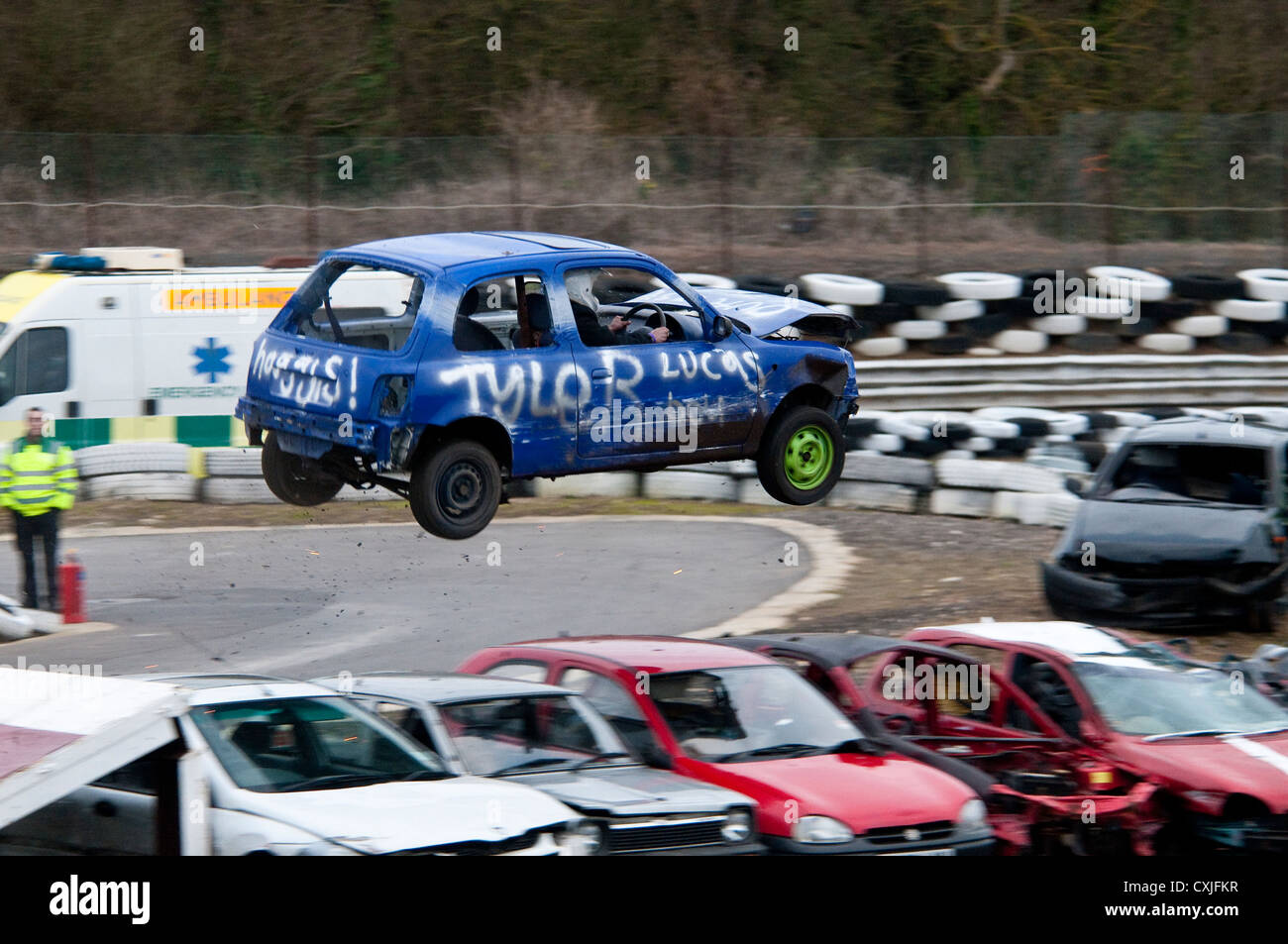 Car Jumping Over Other Cars at a Banger Race Stock Photo - Alamy