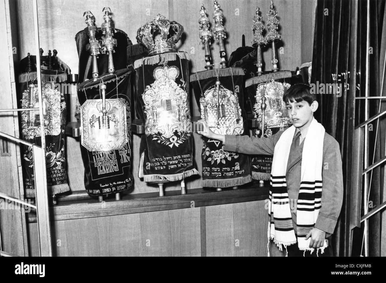 Young Jewish boy ready for bar mitzvah at Ark containing Torah in ...