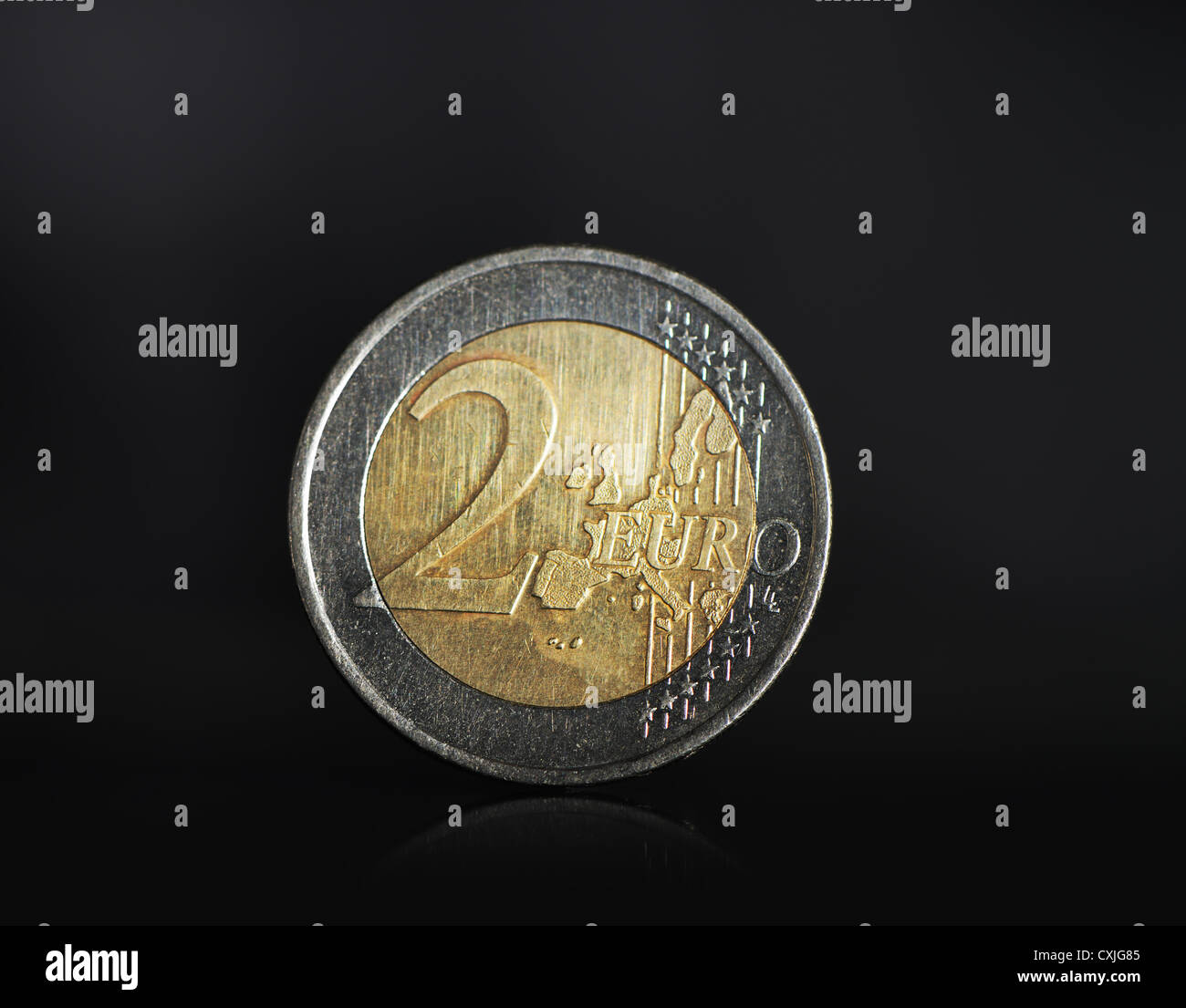 Two euro coin. Dark background with backlight Stock Photo - Alamy