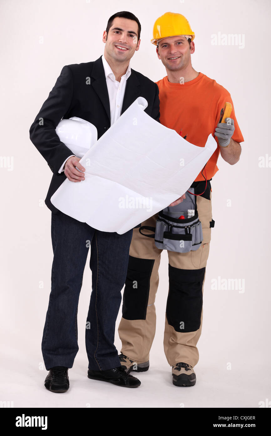 Tradesman and engineer working together Stock Photo - Alamy