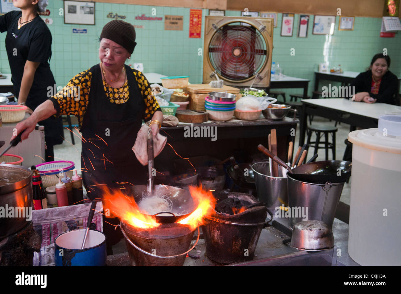 cooking seafood and noodles at Ran Jay Fai in Bangkok, Thailand Stock ...