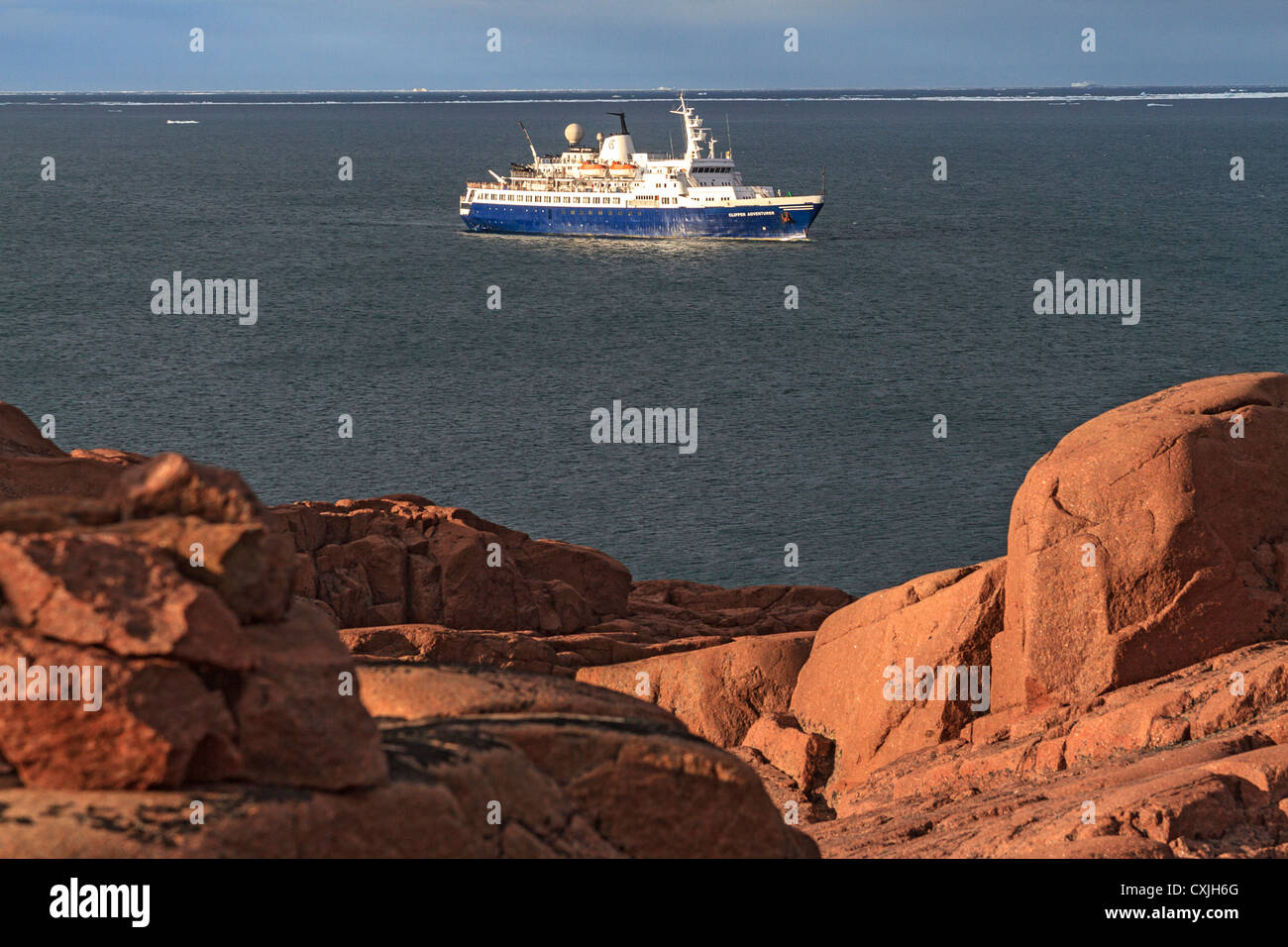 Adventure Canada cruise ship Clipper Adventurer anchored off Pim Island ...