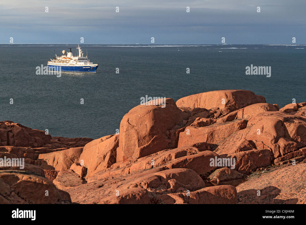 Adventure Canada cruise ship Clipper Adventurer anchored off Pim Island ...