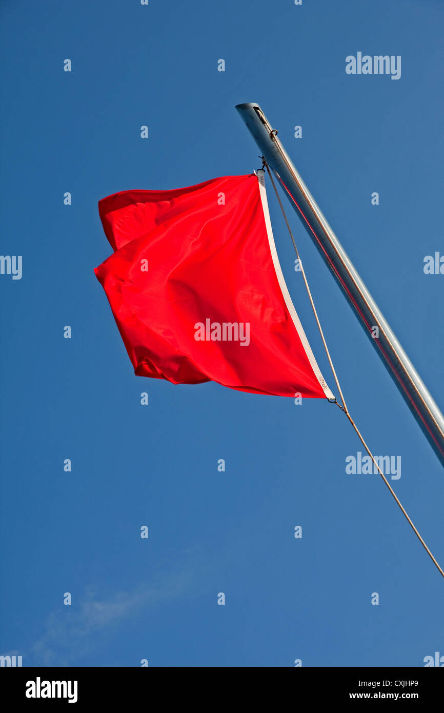 Red flag flying hi-res stock photography and images - Alamy