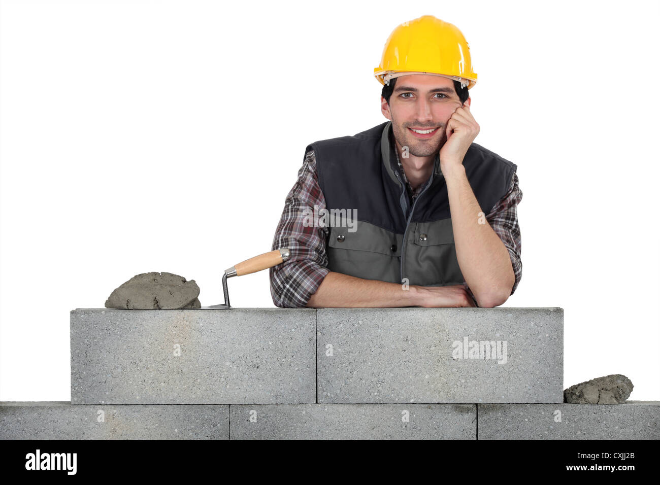 mason putting cement on a wall Stock Photo - Alamy