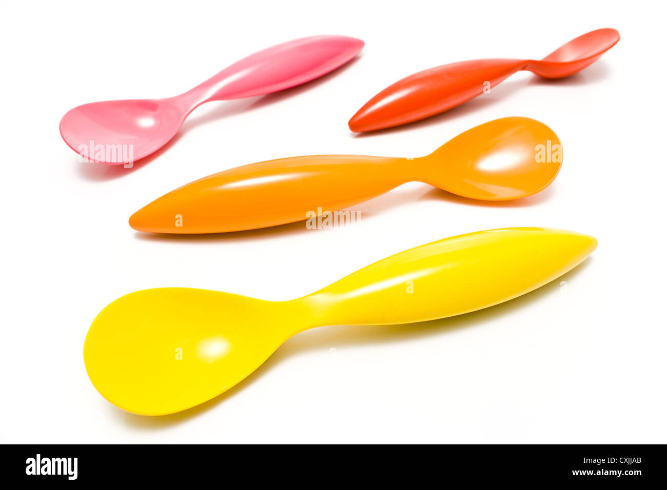 Colorful spoons isolated on white Stock Photo - Alamy