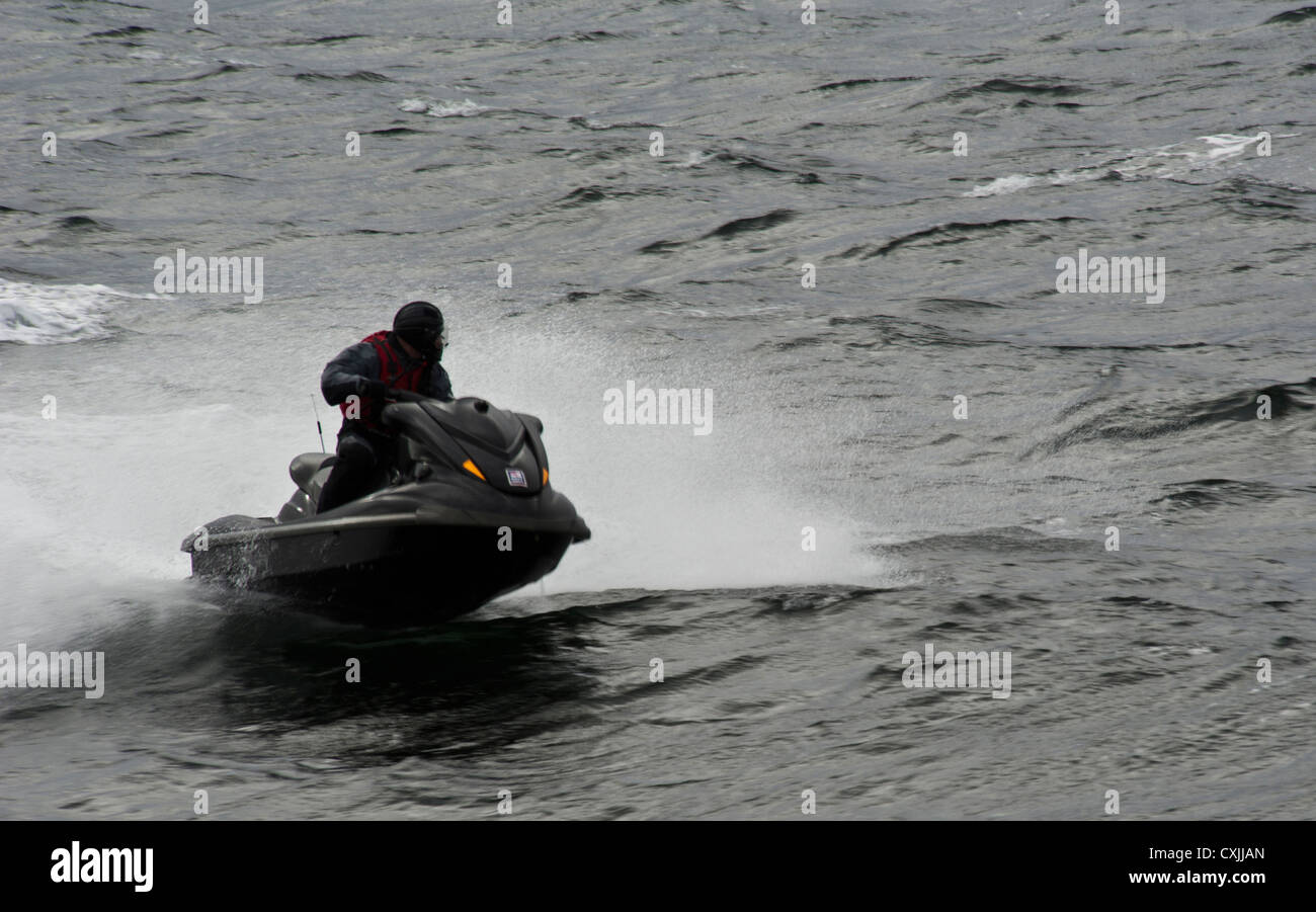 A rider on a personal watercraft simulates a small boat attack on the ...