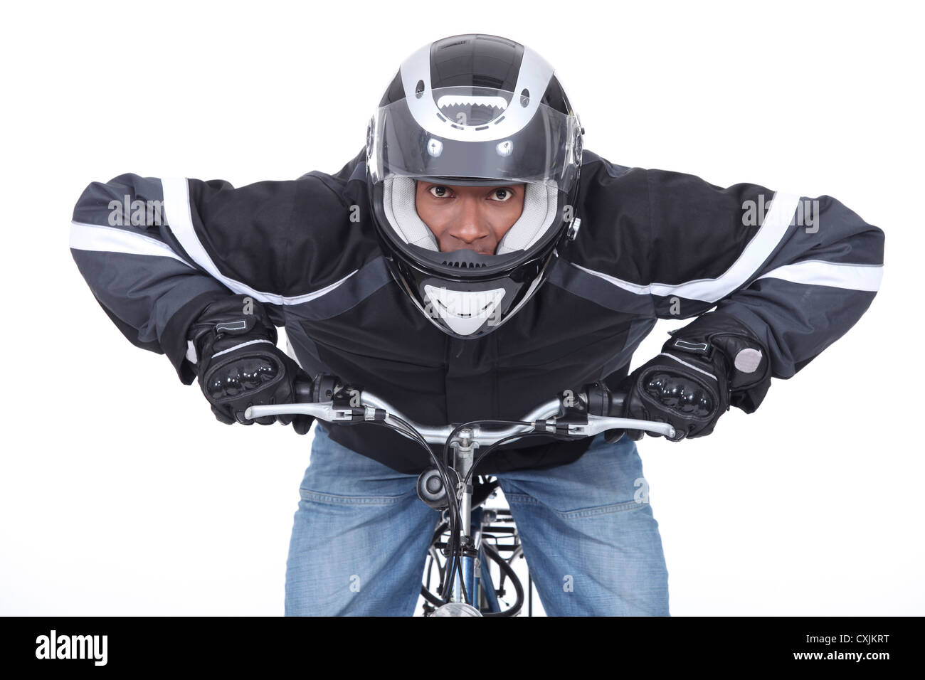 Motorcyclist on a push bike Stock Photo - Alamy
