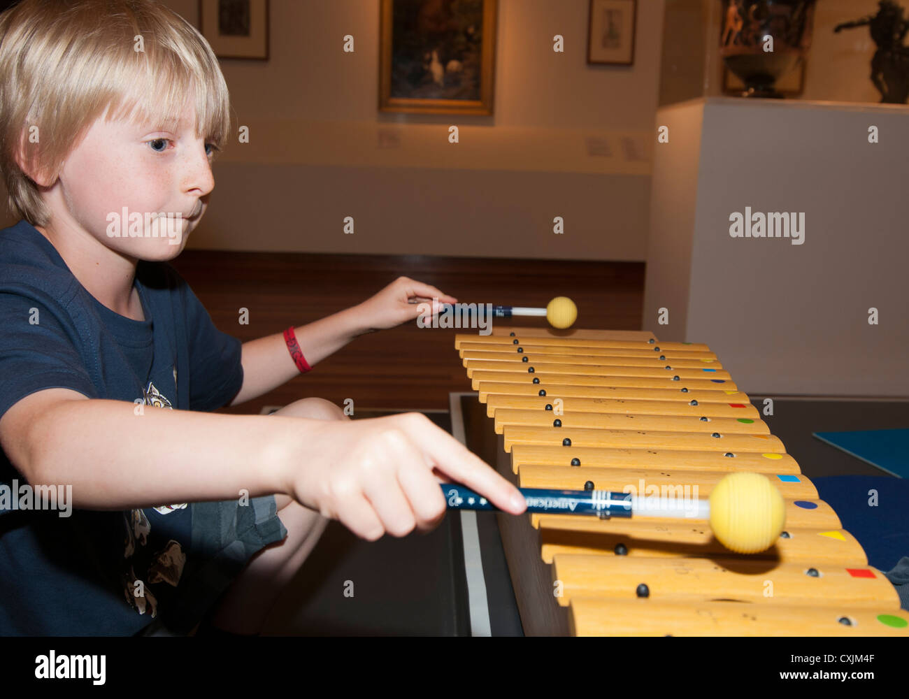 Boy playing the glockenspiel Stock Photo - Alamy