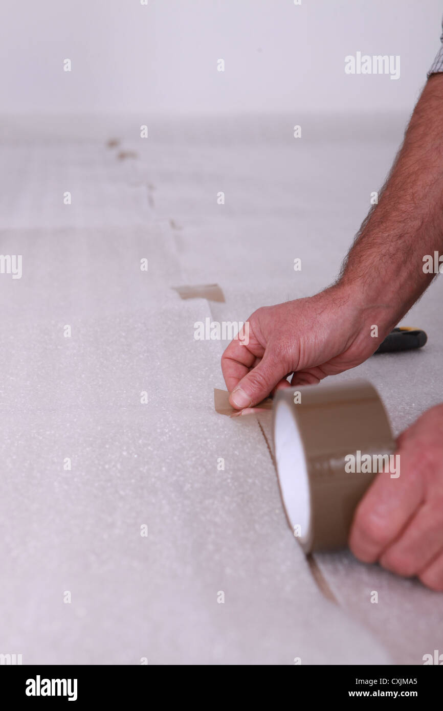 Man taping the floor Stock Photo - Alamy
