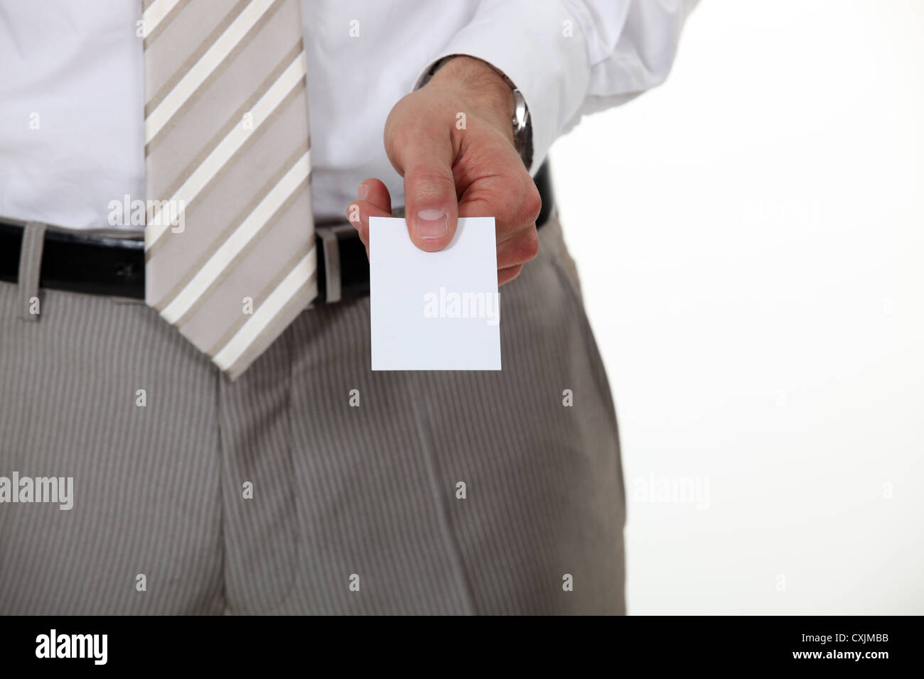 Businessman offering his card Stock Photo - Alamy
