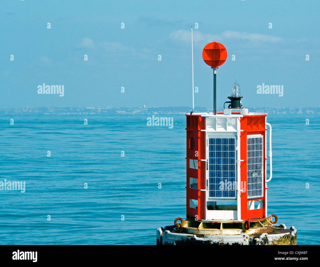 Bright maritime buoy in the middle of the ocean, surrounded by blue ...