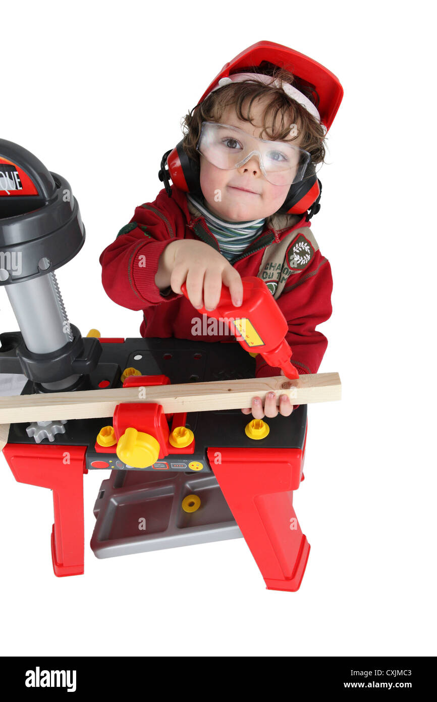 Little boy pretending to be a carpenter Stock Photo - Alamy