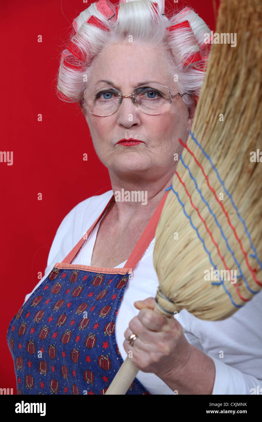 Lady with broom hi-res stock photography and images - Alamy