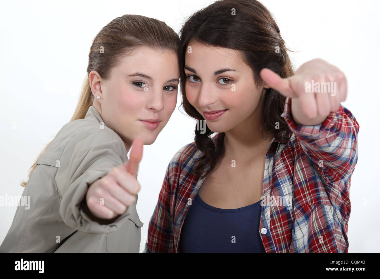 Thumbs up from two friends Stock Photo - Alamy
