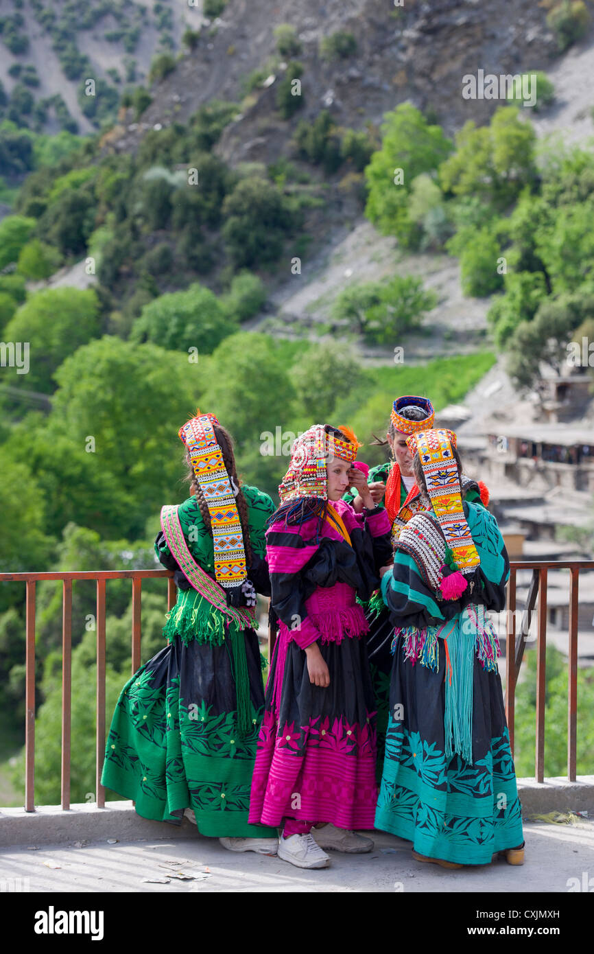 Kalash women looking out from the Grum Charso (dancing ground) at the ...