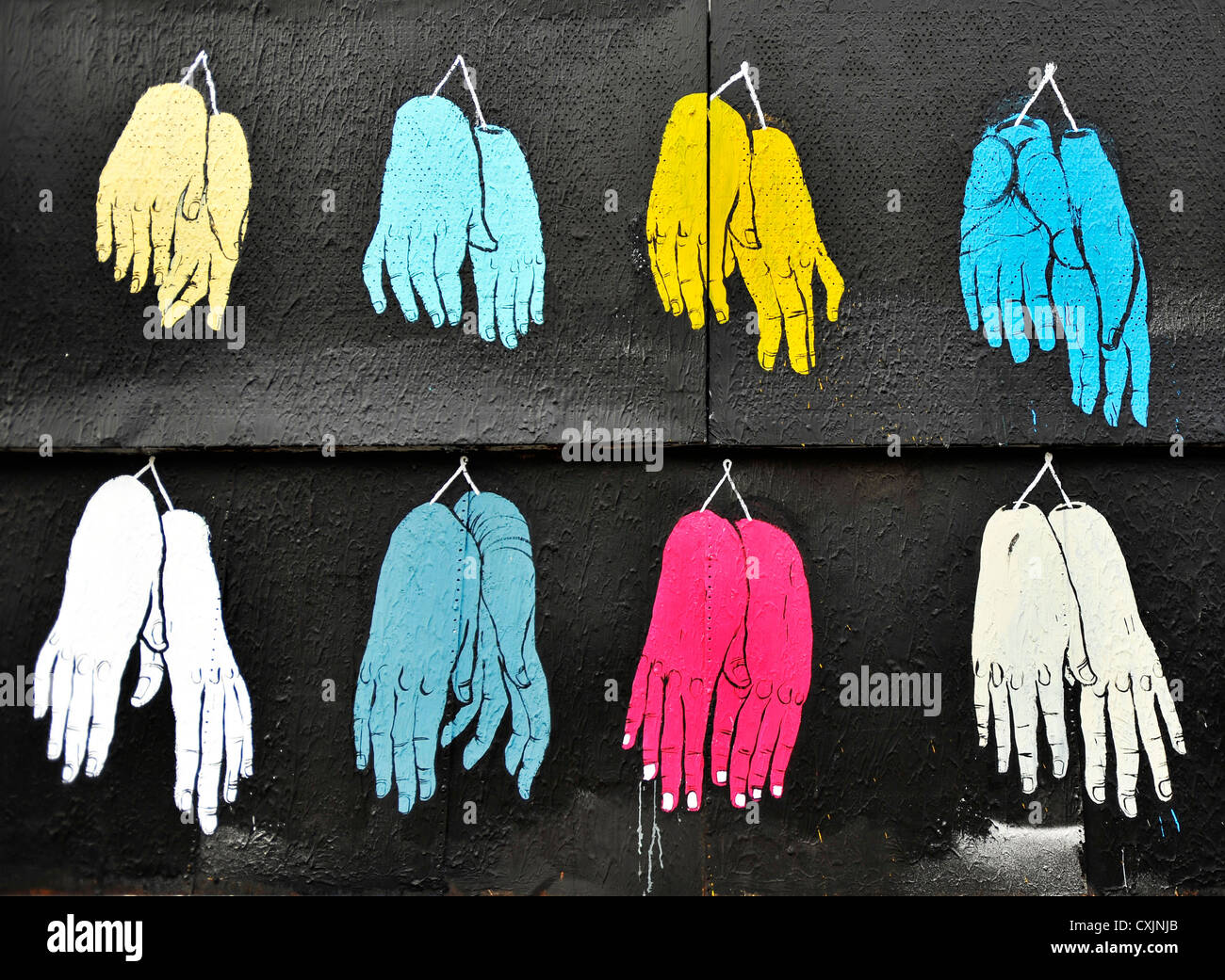 Street graffiti helping hands of all kinds Stock Photo - Alamy