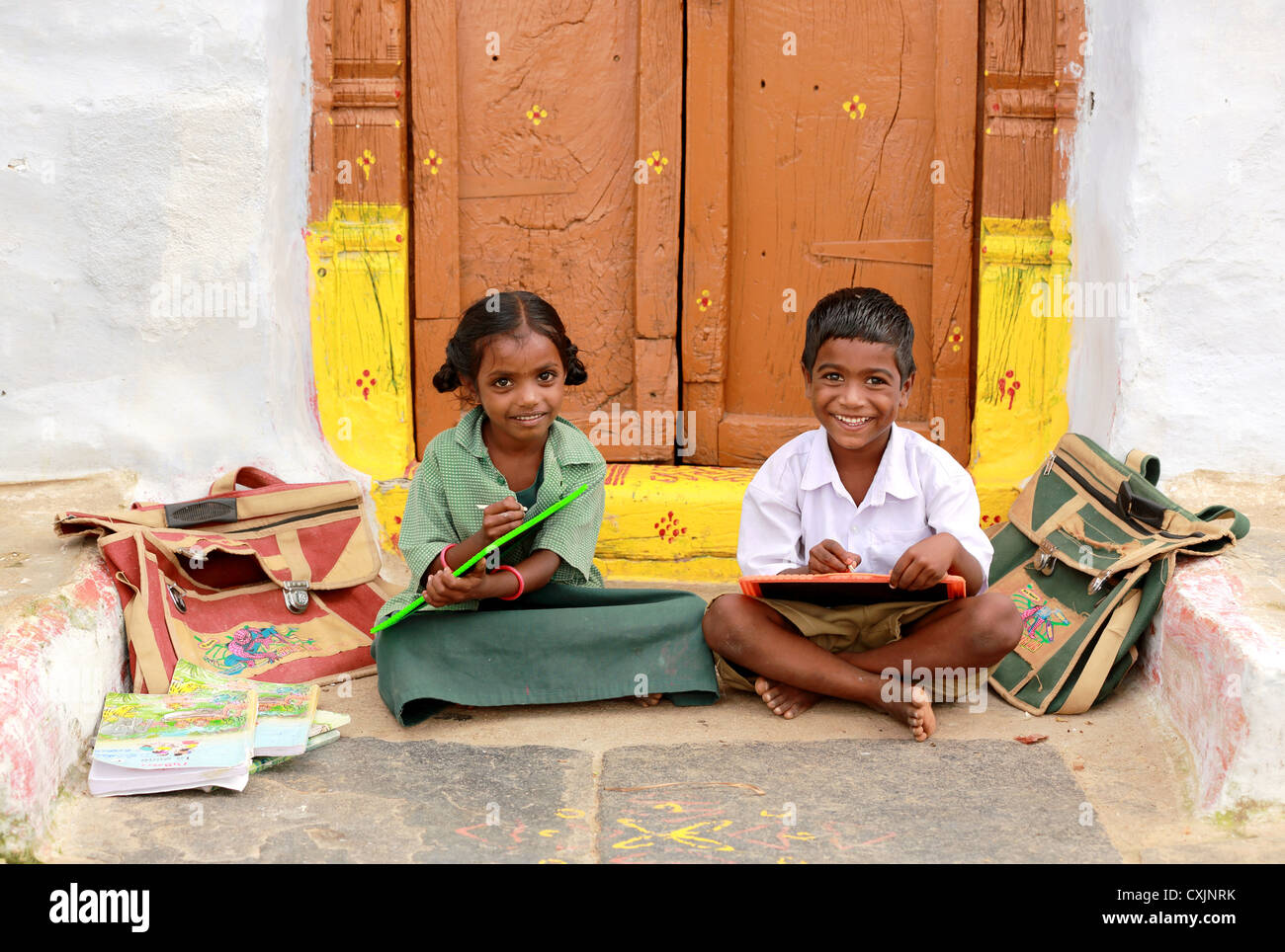 Indian school children best friends doing homework Andhra Pradesh South ...