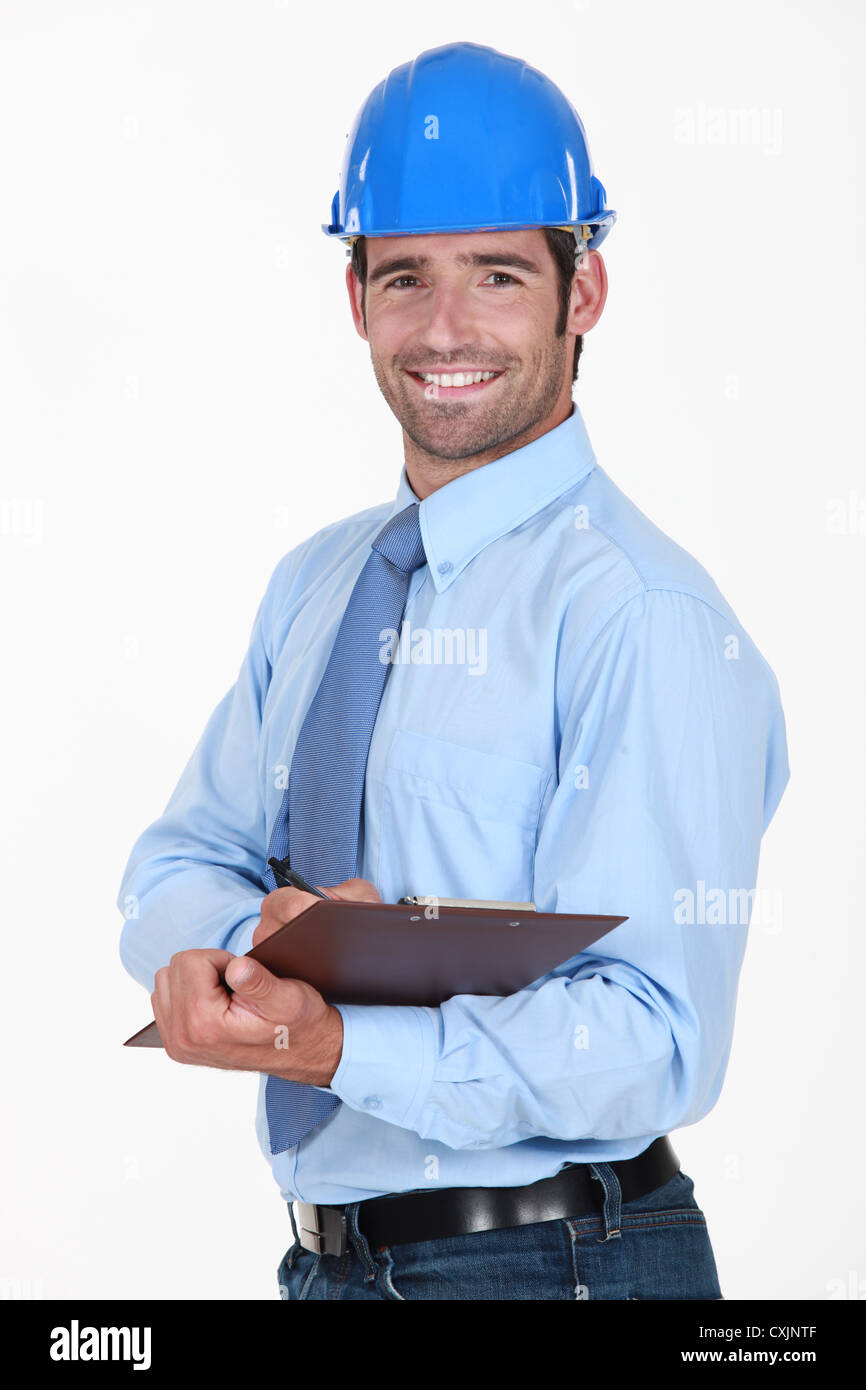 Supervisor holding clipboard Stock Photo - Alamy
