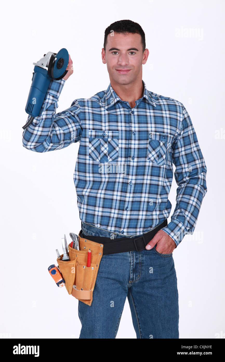 Man holding an angle grinder Stock Photo - Alamy