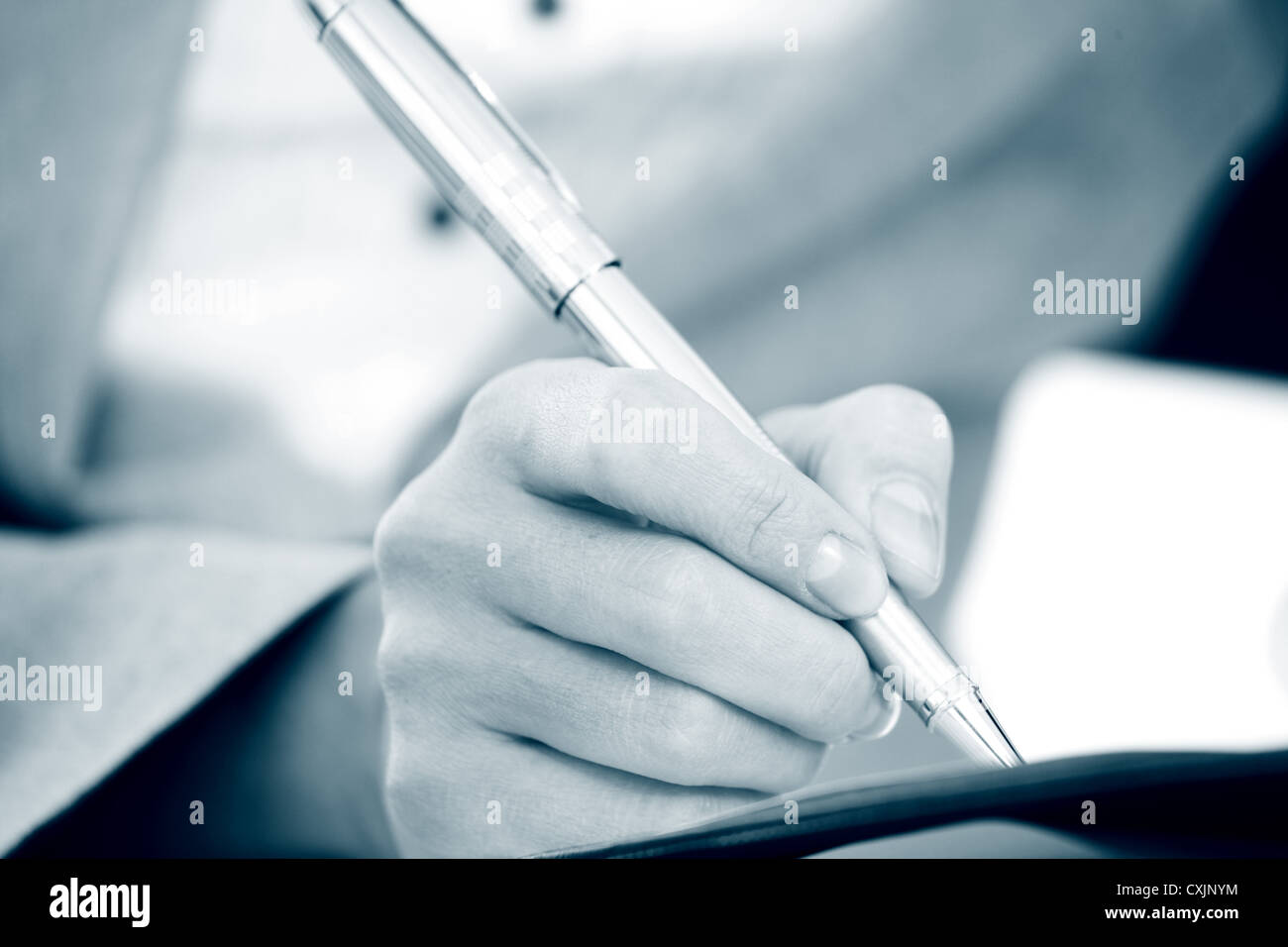woman write by pen on paper Stock Photo - Alamy