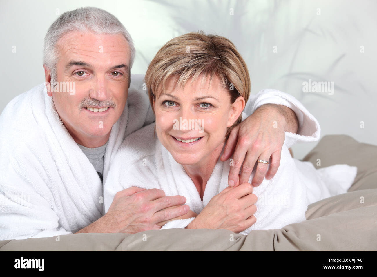 Mature couple in bed Stock Photo - Alamy