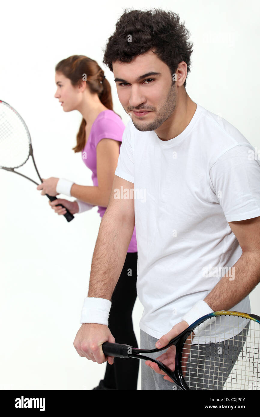 Couple playing tennis Stock Photo - Alamy