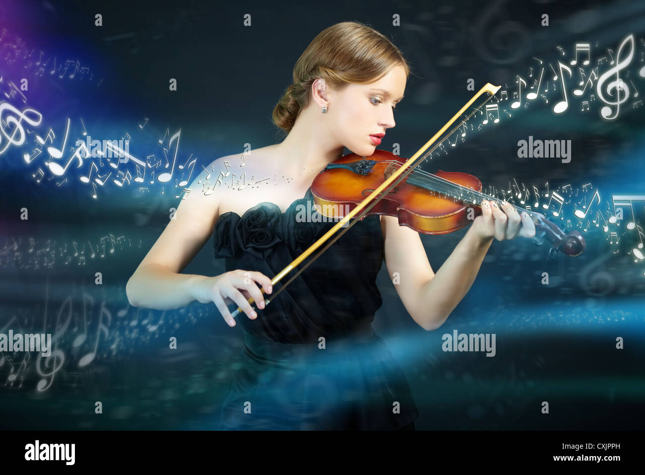 Portrait of a young female playing the violin over creative background ...