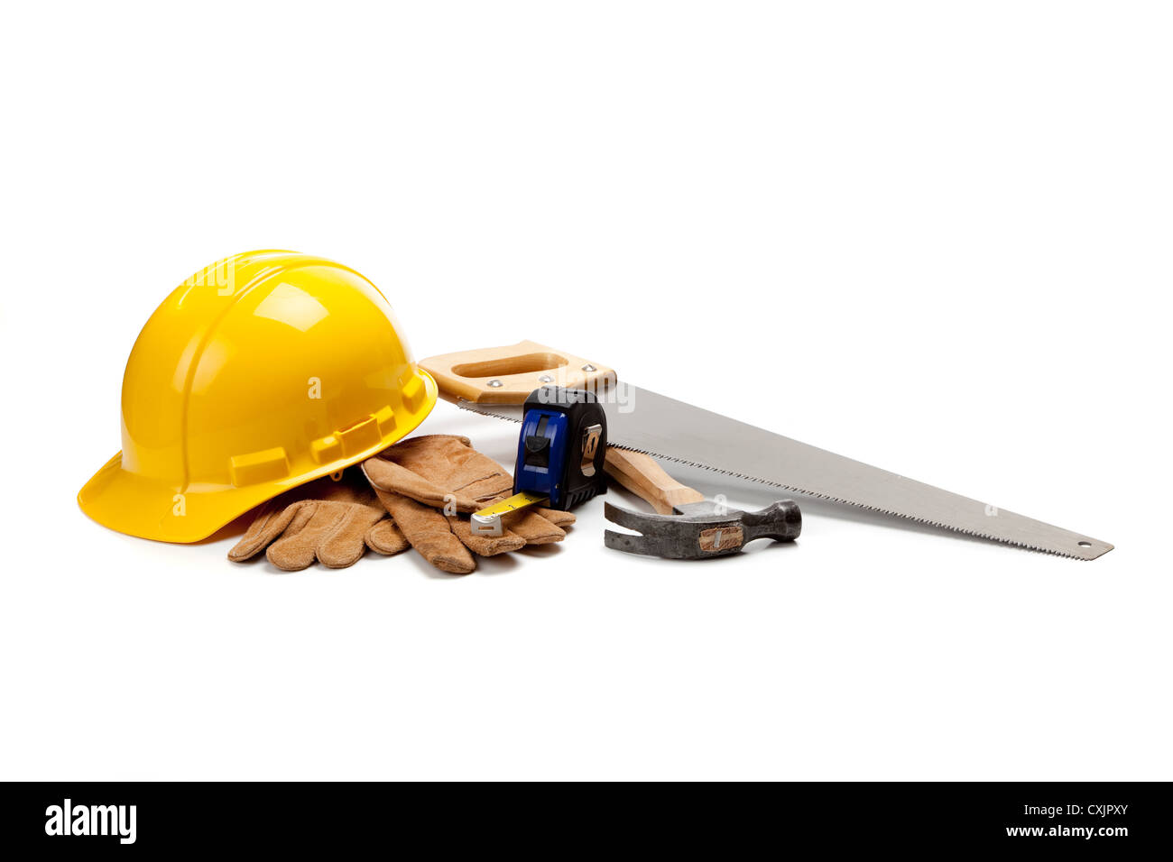 Yellow hard hard and work gloves with various tools on a white ...