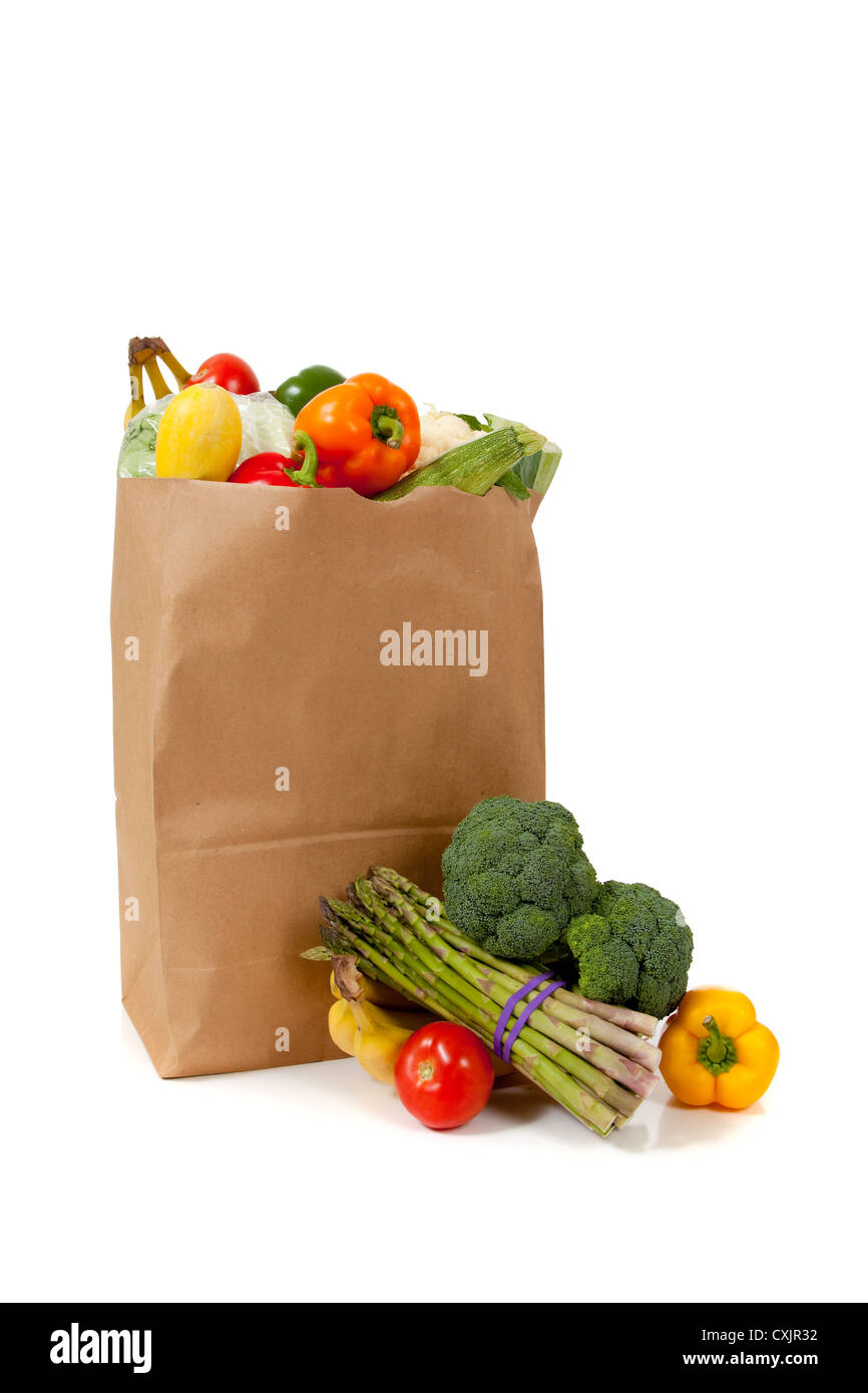 Brown paper grocery sack with fresh vegetables on a white background ...