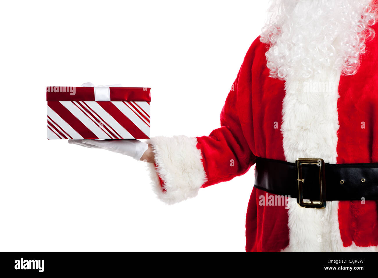 Santa's hand holding a red and wrapped Christmas present on a white ...