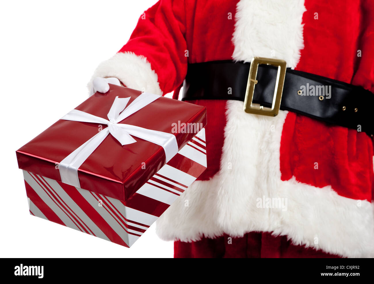Santa's hand holding a red and wrapped Christmas present on a white ...