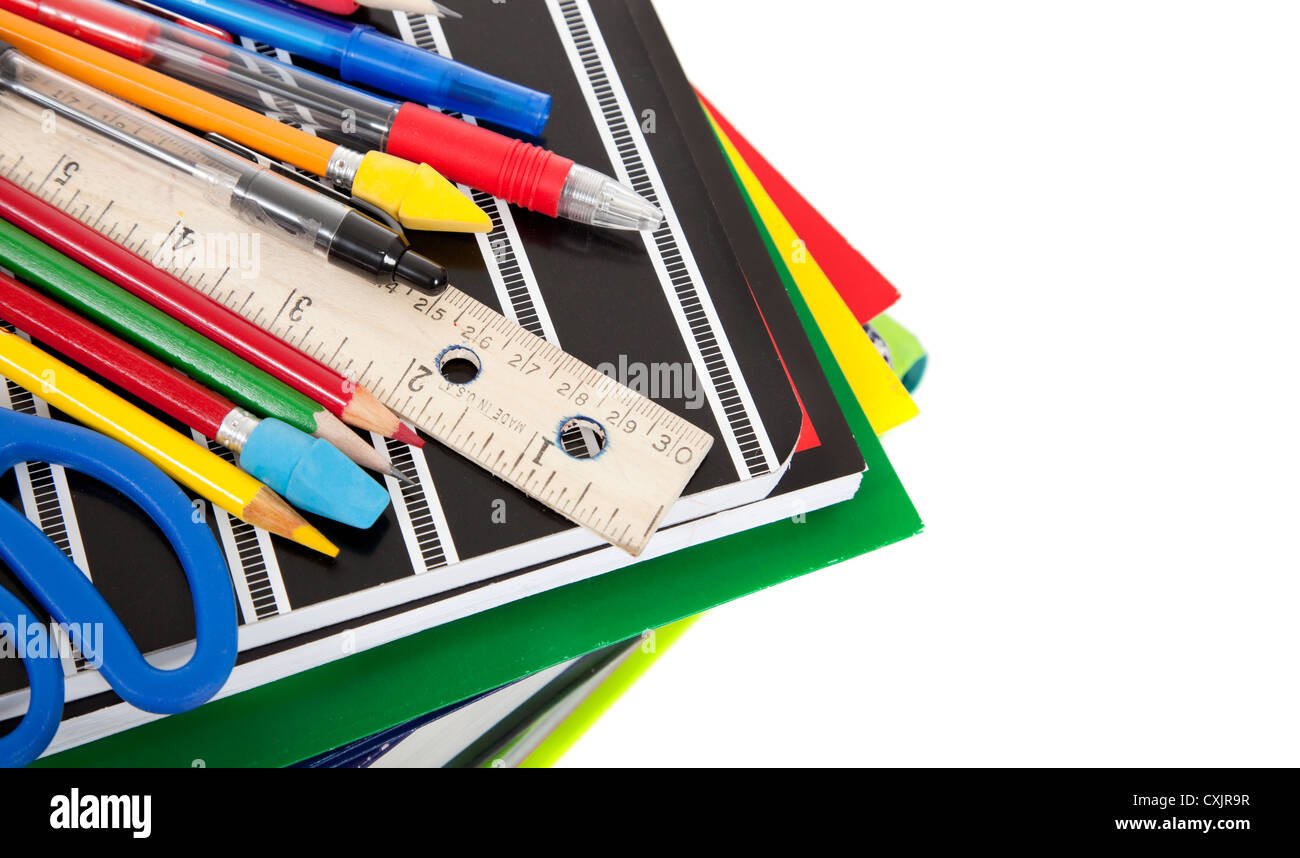 Stack of notebooks with school supplies on a white background Stock ...